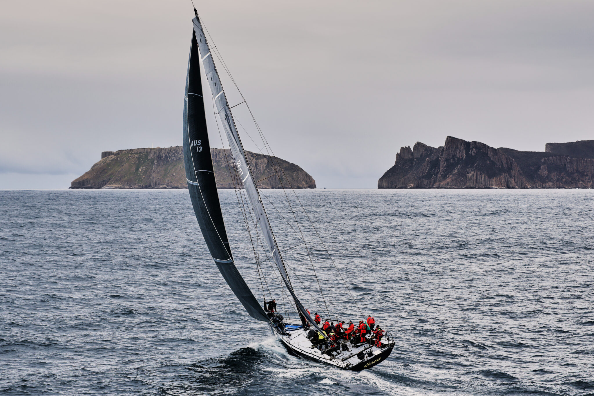 Wind becoming elusive as mini-maxis round Tasman Island - Cruising ...